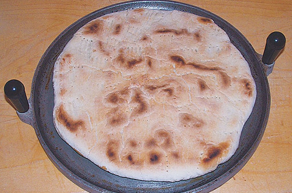 La pizza al testo (una volta sotto al fuoco) « ilTamTam.it il giornale ...